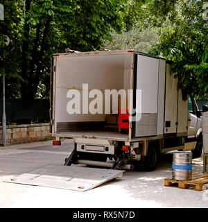 Commercial goods delivery van with lift ramp Stock Photo - Alamy