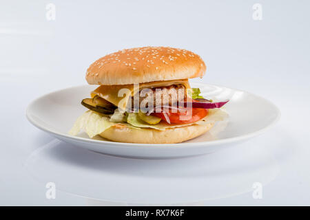 Dried slices of tasty mushrooms with peppers and parsley on black stone ...