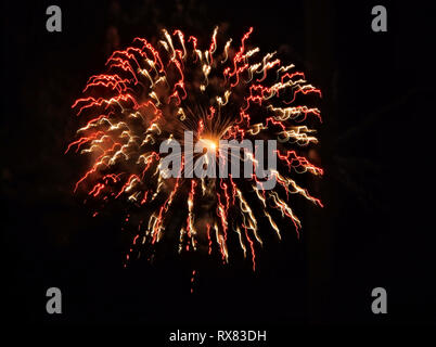 An explosion of bright single fireworks, against the background of the ...