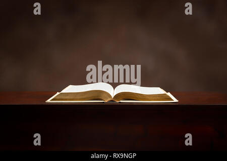 Horizontal close-up shot of an open Bible showing John 3:16 in red ...