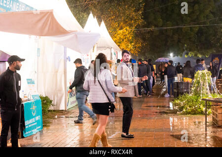 People roaming around shopping from open tents Stock Photo - Alamy
