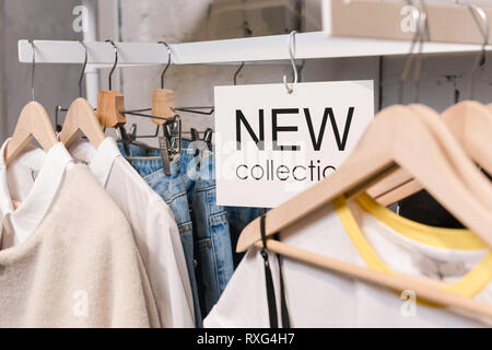 New collection nameplate in female clothes store Stock Photo - Alamy