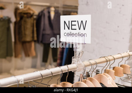 New collection nameplate in female clothes store Stock Photo - Alamy