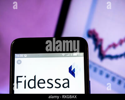 Fidessa Group plc company logo seen displayed on smart phone Stock ...