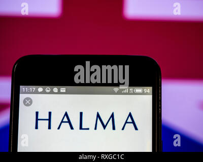 The Halma plc logo is seen on an LED screen in the background while a ...