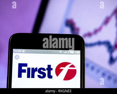 FirstGroup plc company logo seen displayed on smart phone Stock Photo ...