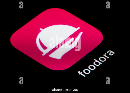 A close-up shot of the Foodora app icon, as seen on the screen of a ...