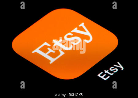 A close-up shot of the Etsy app icon, as seen on the screen of a smart ...