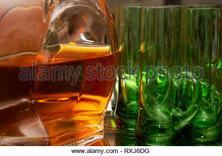Glass bottle of Serbian traditional drink Rakia on the wooden table ...