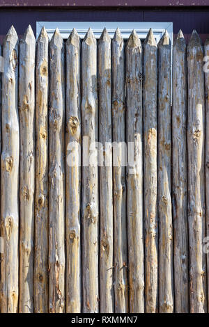 Ancient fence from trunks of trees. Protection against enemies in olden ...