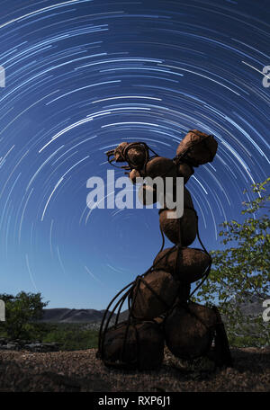 Namibia, Hardap, Long way in green nature, on the gravel road on the ...