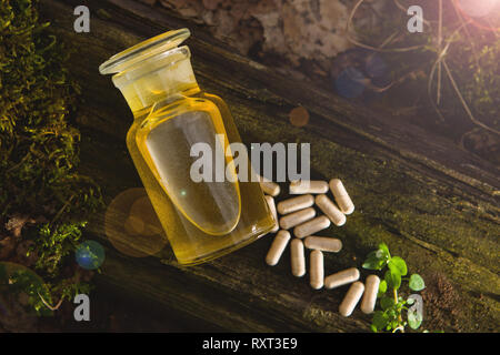 Homeopathic medicine (pills, liquid homeopathic extract) pictured with ...