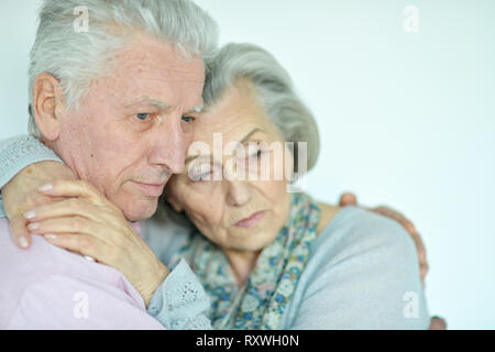 Portrait of sad senior couple posing at home Stock Photo - Alamy