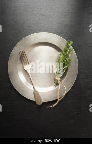 Vintage Table setting with rosemary decor Stock Photo - Alamy