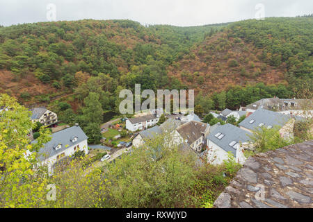 A high-angle of Meander river stream meadows with green and yellow ...