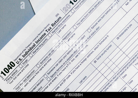 Tax forms 1040. U.S Individual Income Tax Return with clock and ...