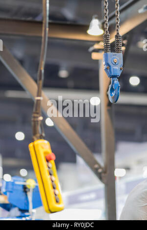 Hanging hoist crane control panel with emergency stop button in an ...