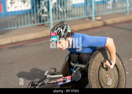 Nikki Emerson racing in the Vitality Big Half half marathon crossing ...