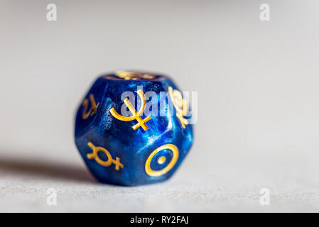 Astrology Dice with symbol of the planet Uranus Stock Photo - Alamy