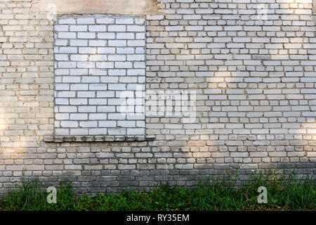 Old gungy white brick wall with bricked up window Stock Photo - Alamy