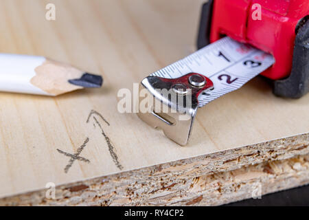 Steel measure and pencil used for measuring in carpentry. Diy ...
