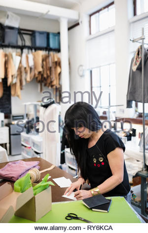 Fashion designer working in studio. Close up design Stock Photo - Alamy