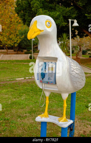 Public telephone booth in the shape of a bird of prey Stock Photo - Alamy