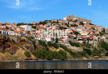 Medieval castle of Molyvos, Lesvos island, Greece and the Greek flag ...