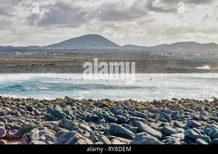 A scenic view of a tranquil lake against green forests and mountains in ...