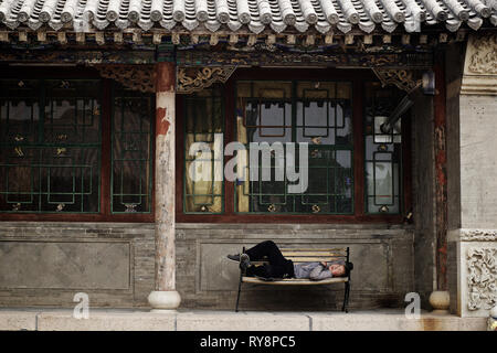 Chinese monk sleeping in in buddhist temple, temple garden, Wutai Shan ...