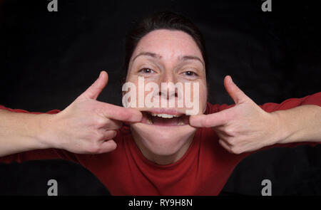 Woman making mockery Stock Photo - Alamy