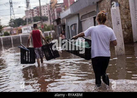 Sao Paulo, Brazil. 12th Mar, 2019. A road covered with mud due to ...
