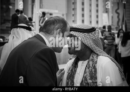 Emirati men greeting each other Stock Photo - Alamy