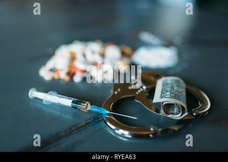Druggy kit, dose path, addiction problem concept. Pills are laid out on ...