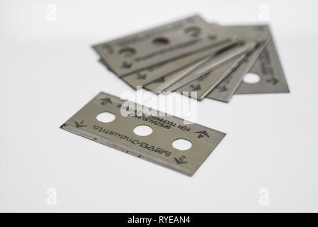 Close up view of metallic razor blade isolated on black background ...