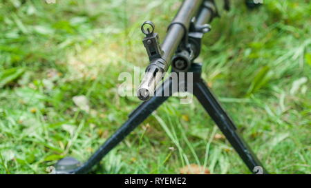 The stand of the sniper firearm on the ground displayed on the outside ...