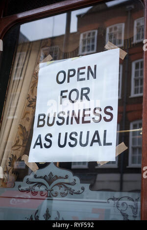 Business open as usual sign Stock Photo - Alamy