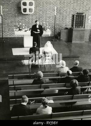 Wedding, priest and couple at the altar for marriage vows in commitment ...