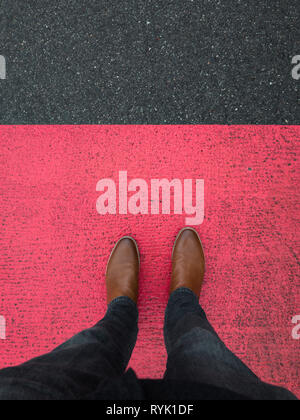 red marking on pavement with leather boot Stock Photo - Alamy