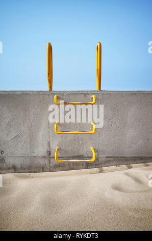 Steel ladder embedded in a concrete wall, conceptual picture Stock ...