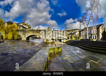 Hebden Water in spate and Old Packhorse Bridge, Hebden Bridge, Pennines ...