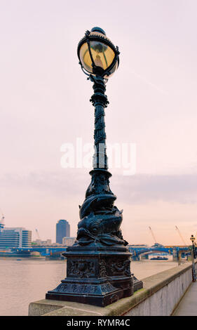London, England, UK. Dolphin lamppost on the South Bank; Millennium ...