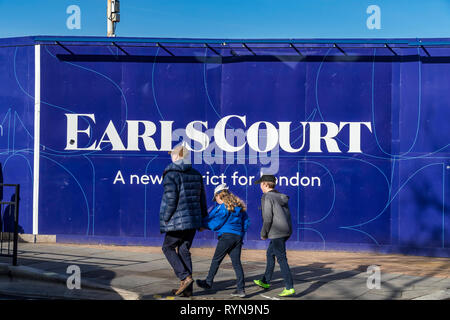 People walk past an advertising hoarding featuring England and Arsenal ...