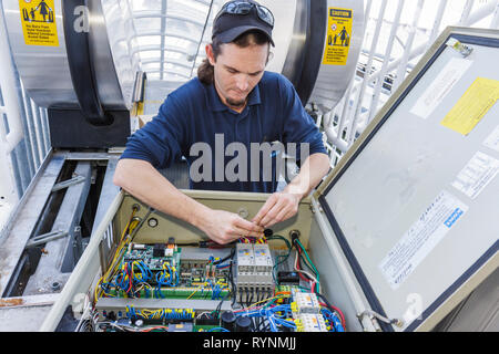 Miami Florida,Metromover,station,escalator,elevator,lift,mechanic,man ...