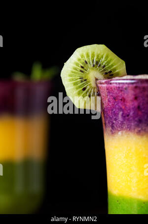 green smoothie on black background or fresh vegetable juice, courgette ...