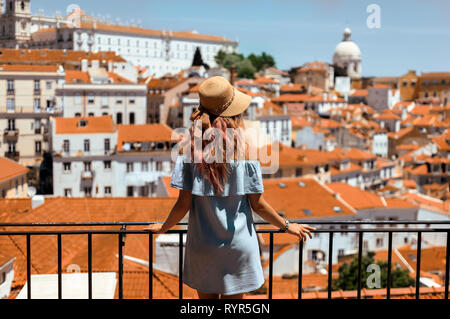 Young female tourist wearing generic dress taking a tour in southern ...