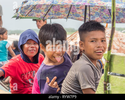 Tabatinga, Brazil - Sep 21, 2018: People on the boat from Ticuna tribe ...