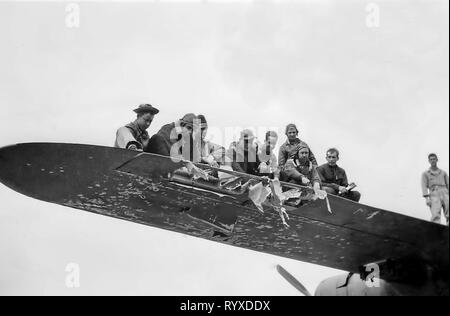Aircraft maintenance ground crew service the radial engine on a Yak ...
