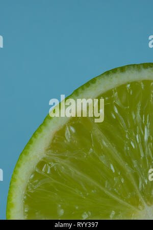 Lime with quarter Stock Photo - Alamy