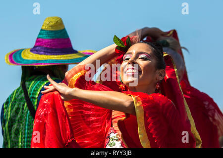 Girl dancing cumbia. The battle of flowers is an event that takes place ...